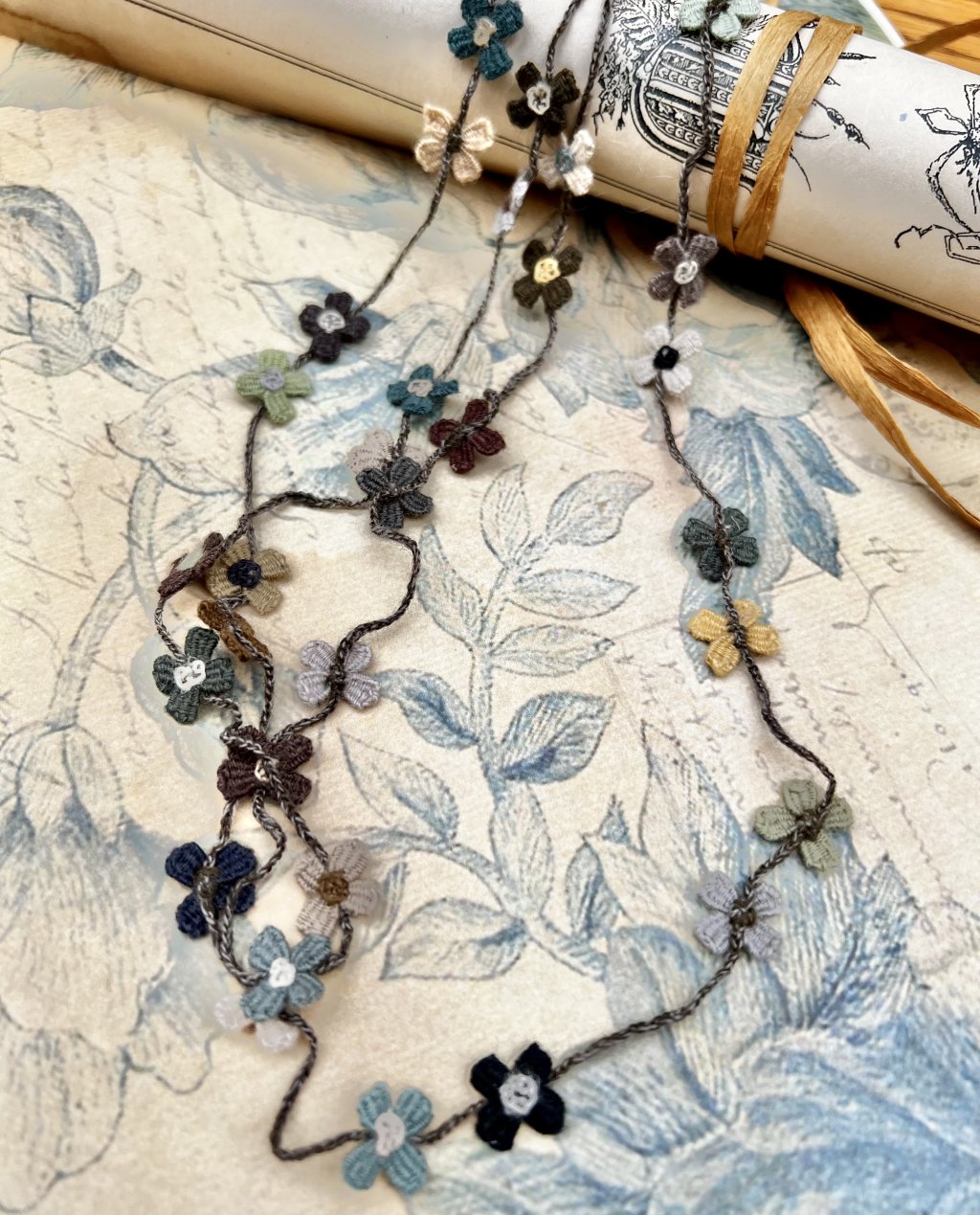 Sophie Digard Crocheted Daisy Chain Necklace in blue, green and brown